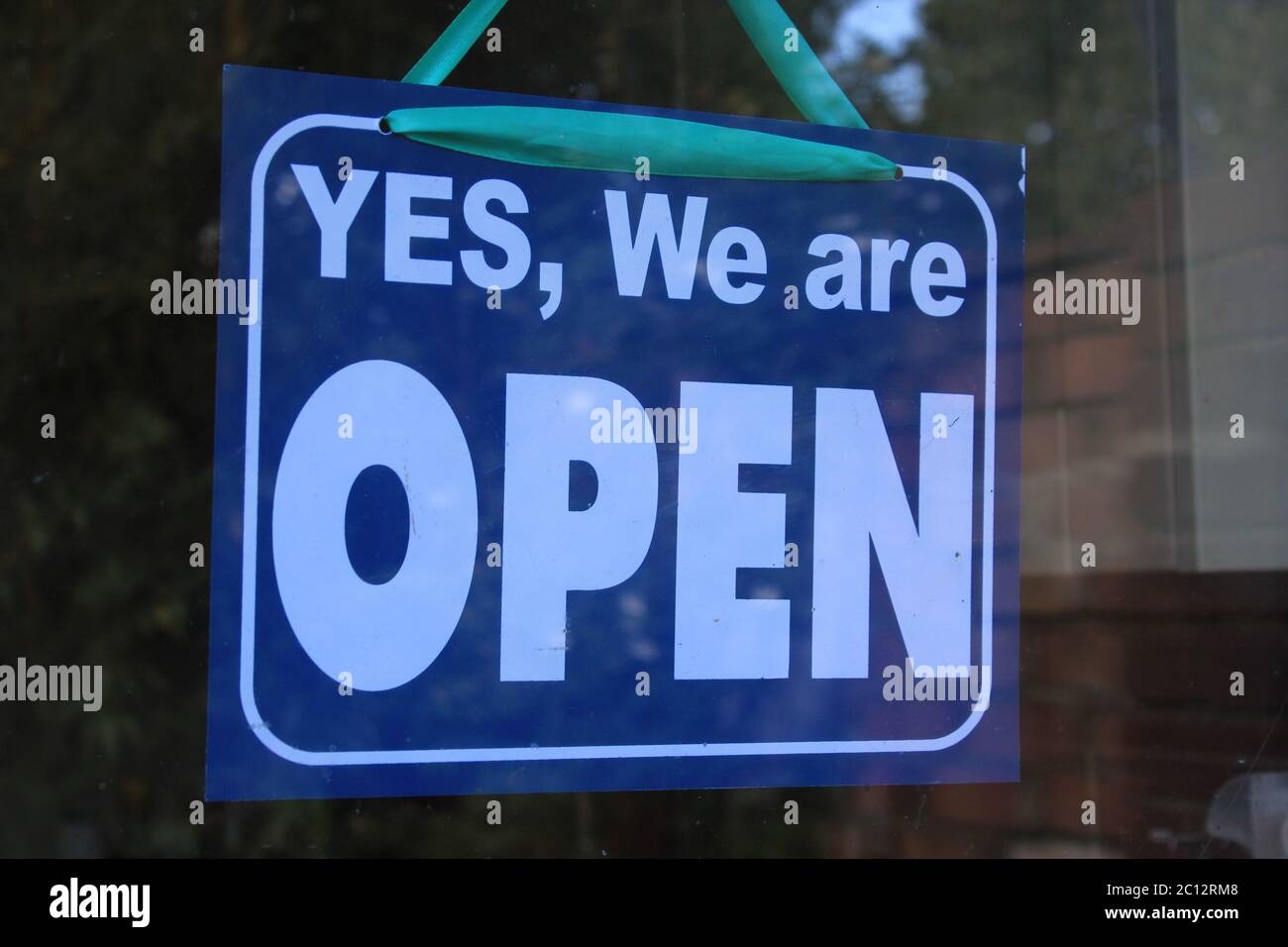 yes we are open sign in cafe shop window Stock Photo - Alamy