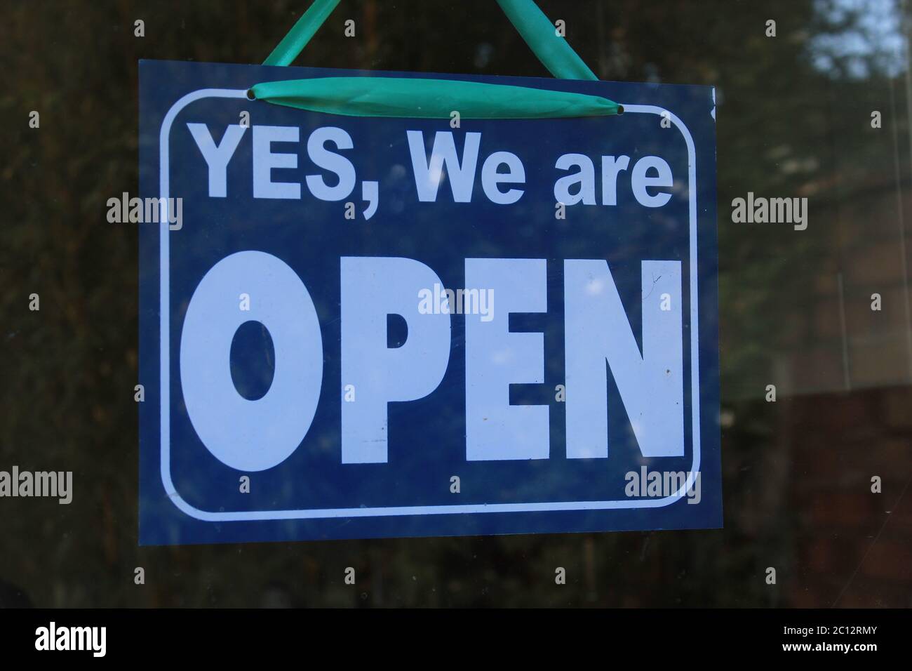 yes we are open sign in cafe shop window Stock Photo - Alamy