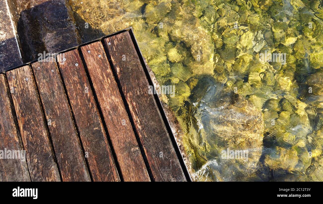 Water textures showing stones in the water Stock Photo - Alamy