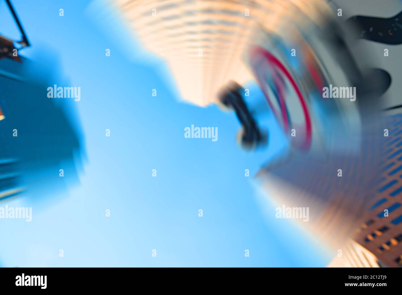 High-rise buildings towering overhead in blurred abstract background ...
