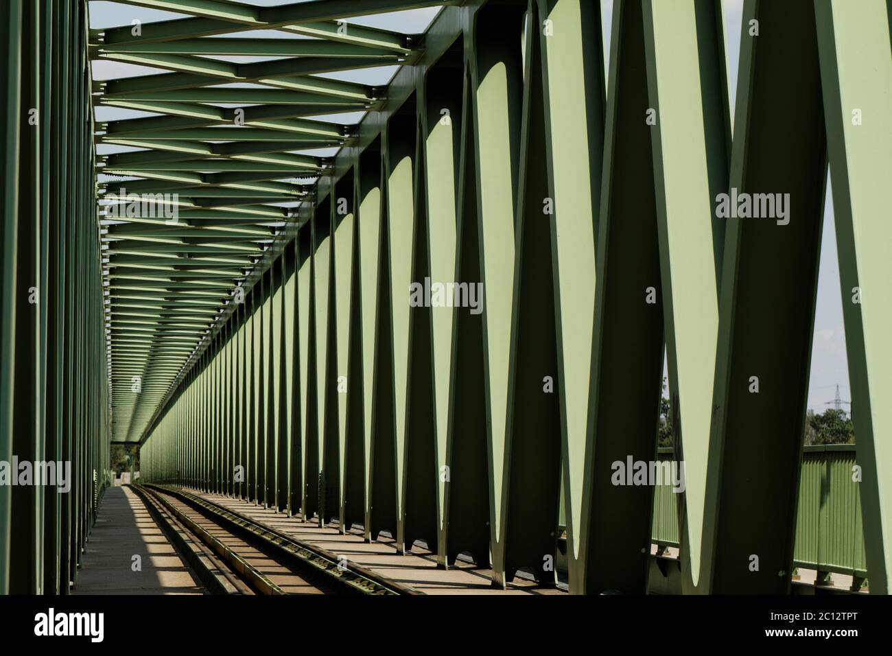 Railway metal bridge perspective view Stock Photo - Alamy