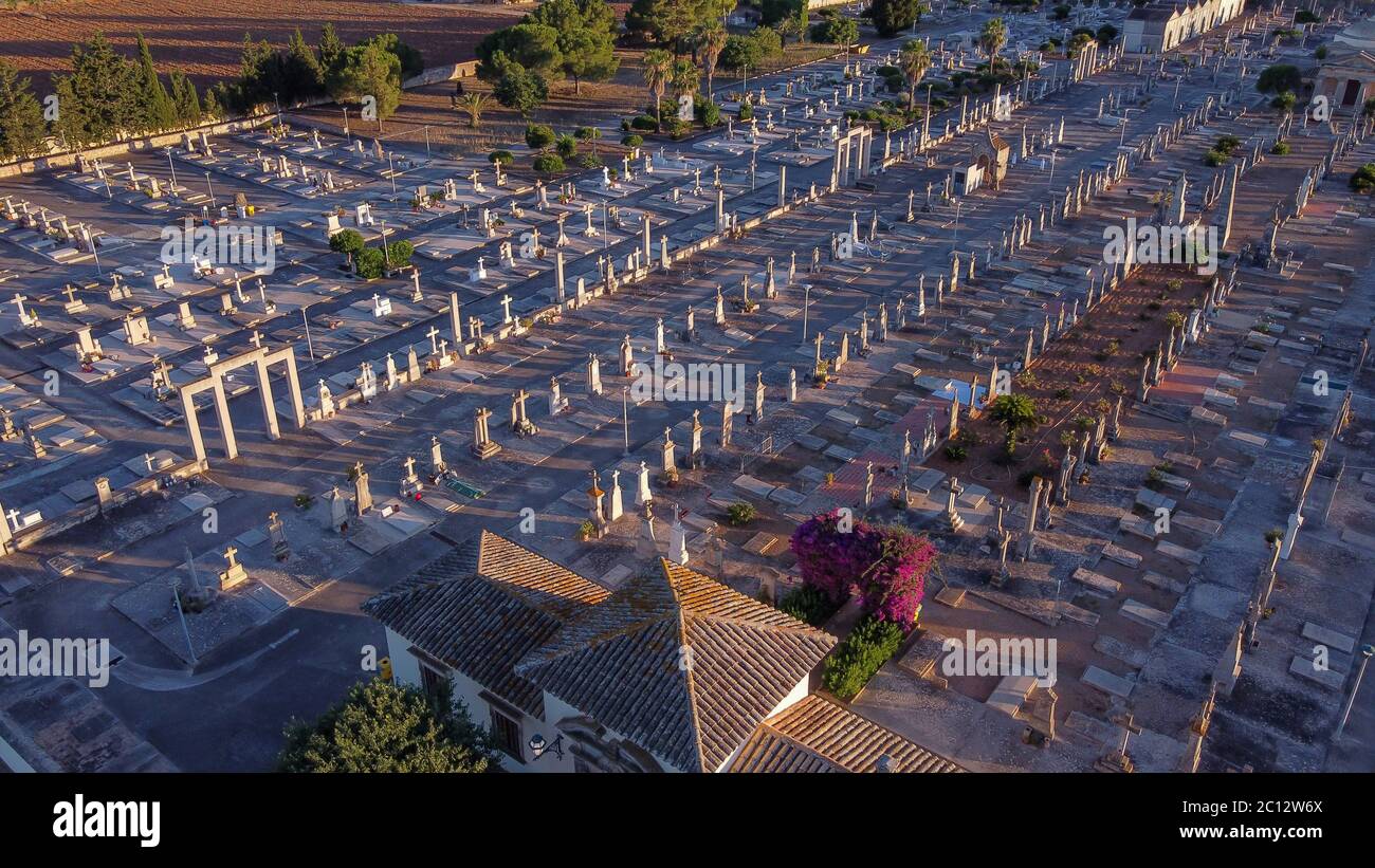 Aerial view of a cementery with cross sculptures, at sunset. Island of ...