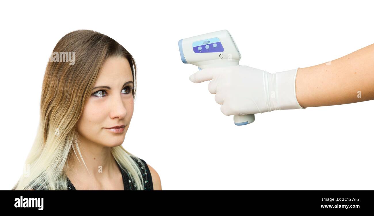 Usage of infrared non-contact forehead thermometer gun to check body ...
