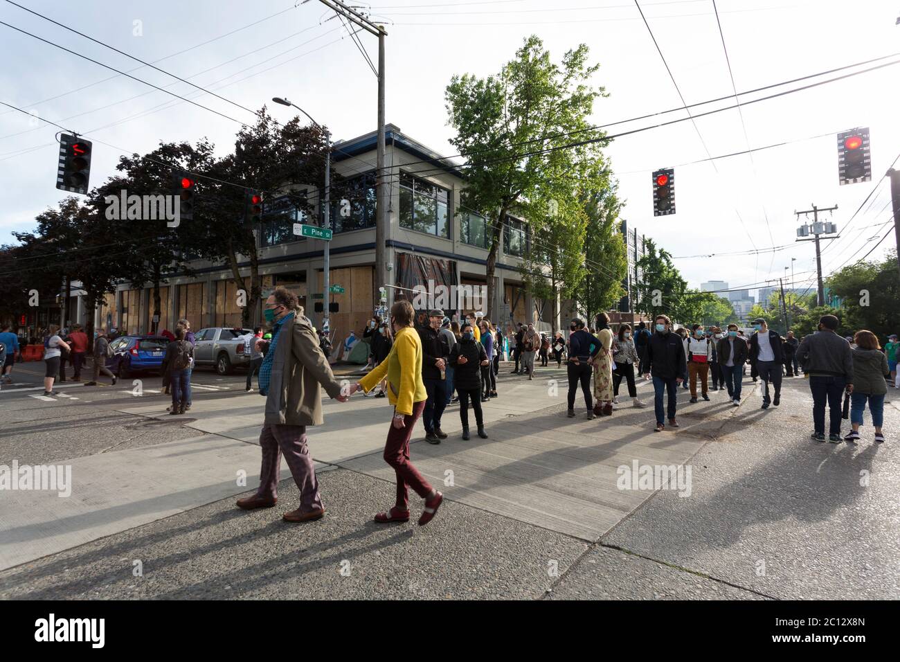 A group of friends pose for a photo on top of the fountain at Cal ...