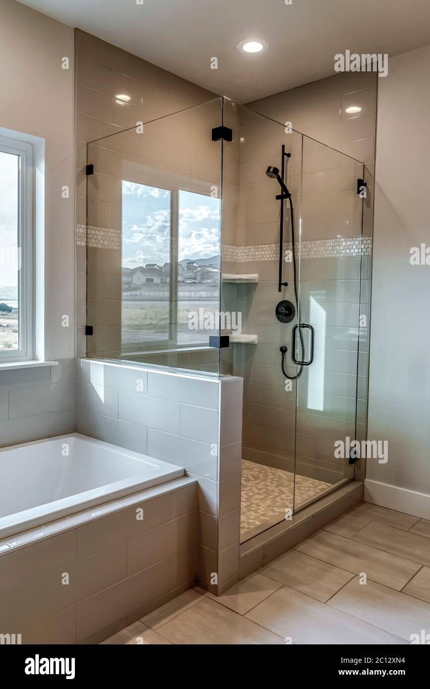 Rectangular walk in shower stall with half glass enclosure and black ...