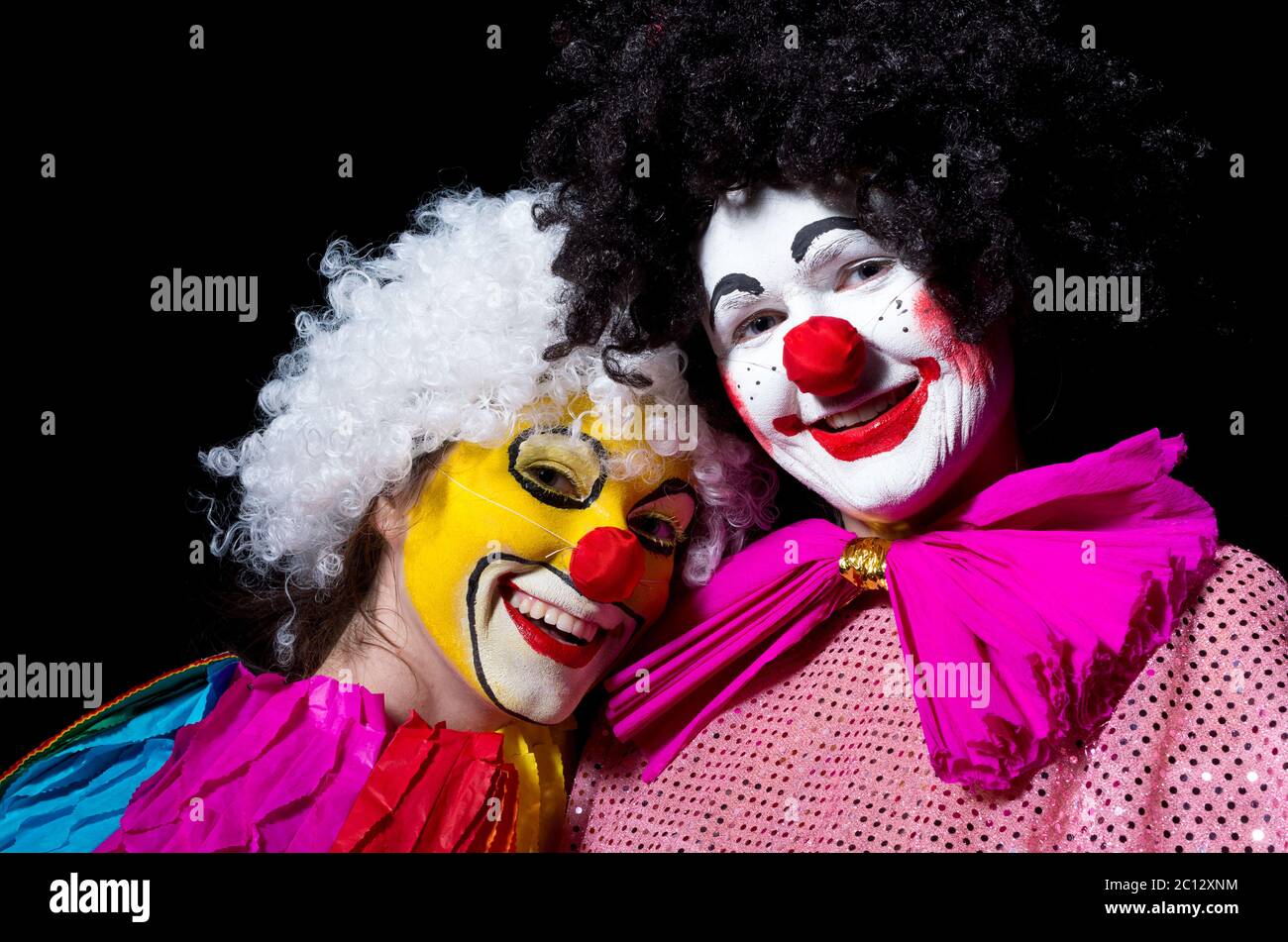 Two birthday clown's in the black background Stock Photo - Alamy