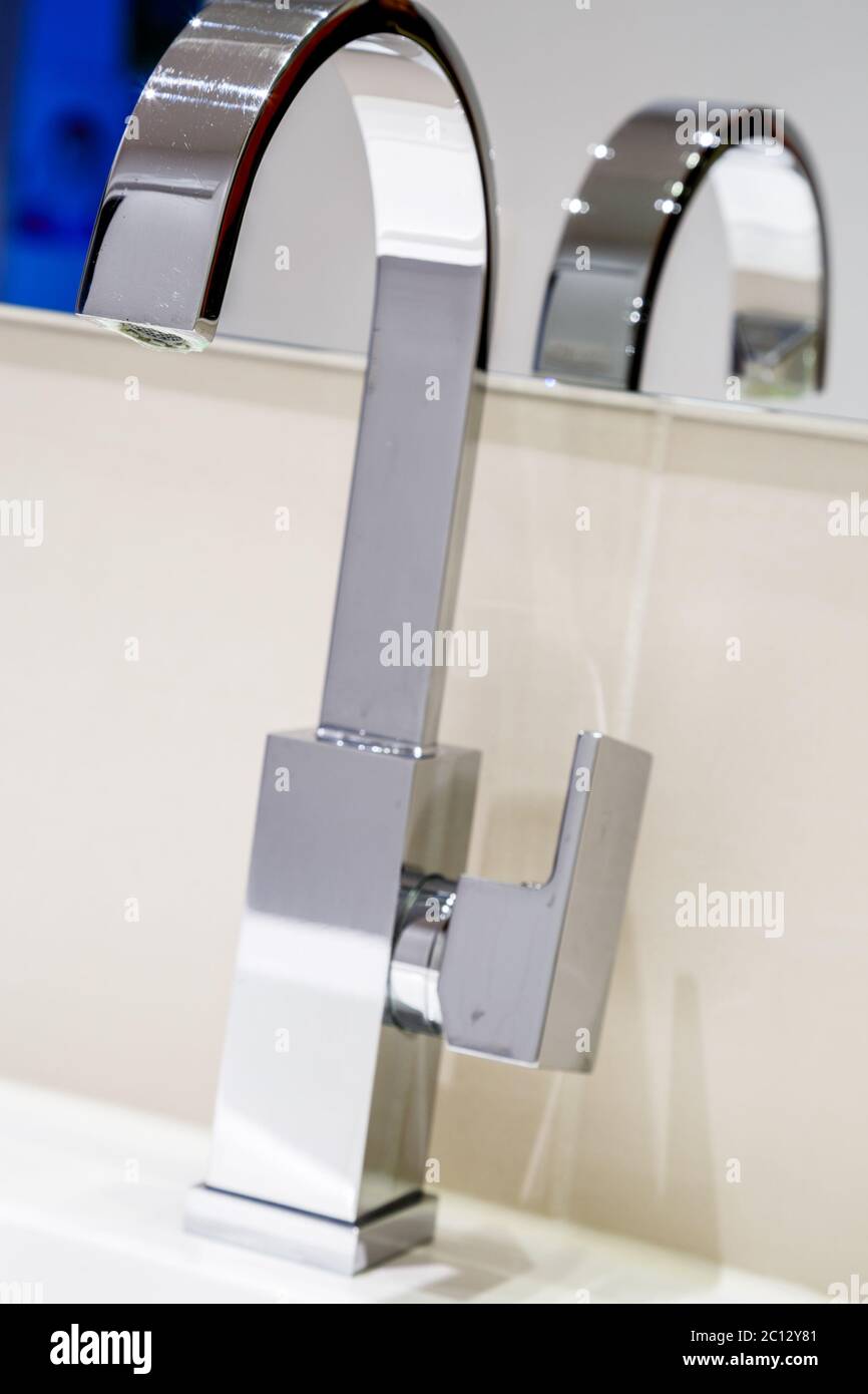 modern stainless steel faucet knob Stock Photo - Alamy