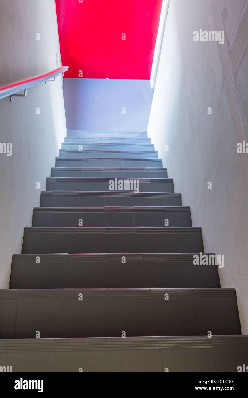 Stairs steps with red background - construction detail Stock Photo - Alamy