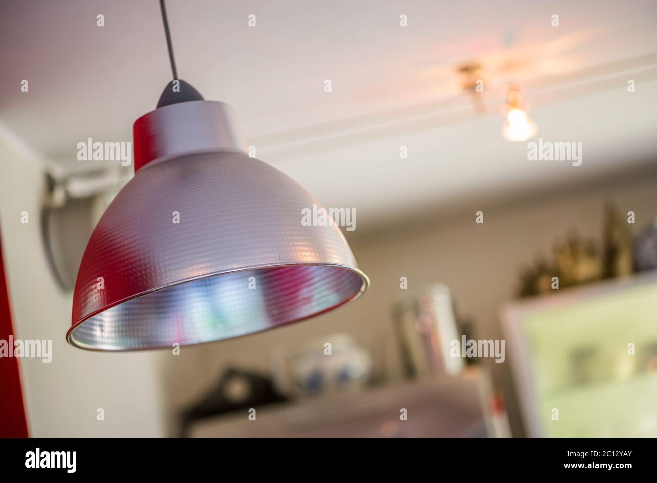 modern stainless steel lamp in kitchen room Stock Photo - Alamy