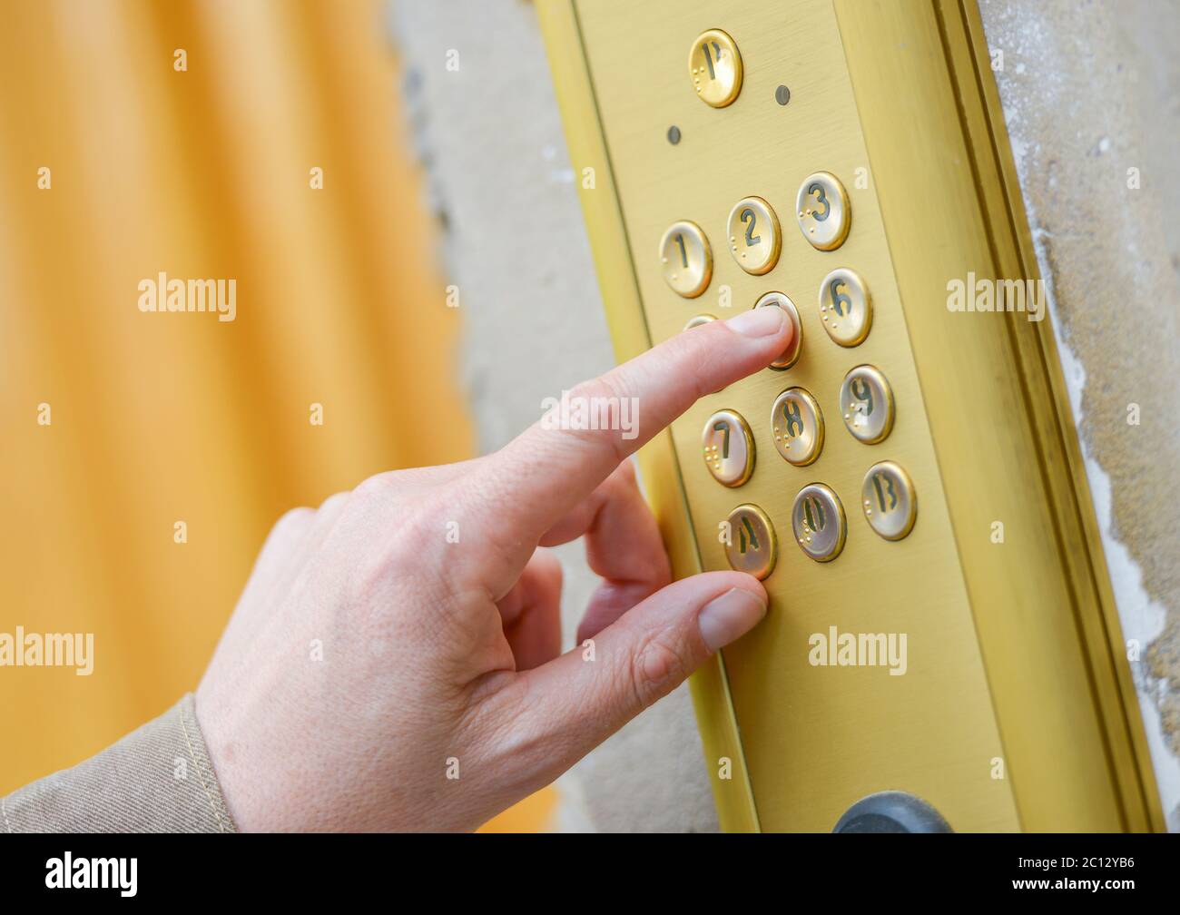 Close-up of person using building intercom Stock Photo - Alamy