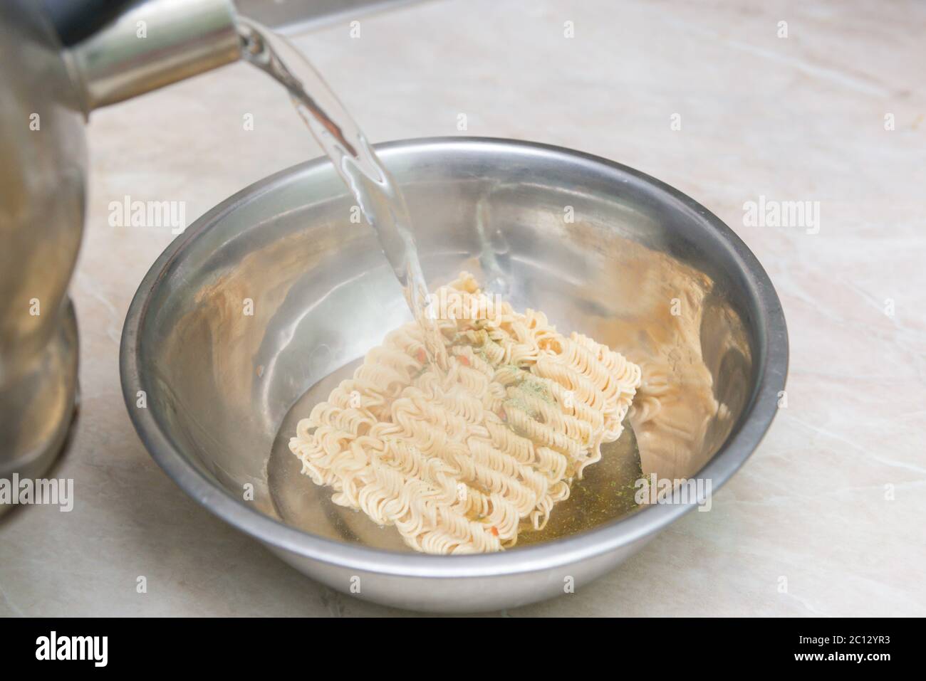 Instant noodle in boiling water hi-res stock photography and images - Alamy