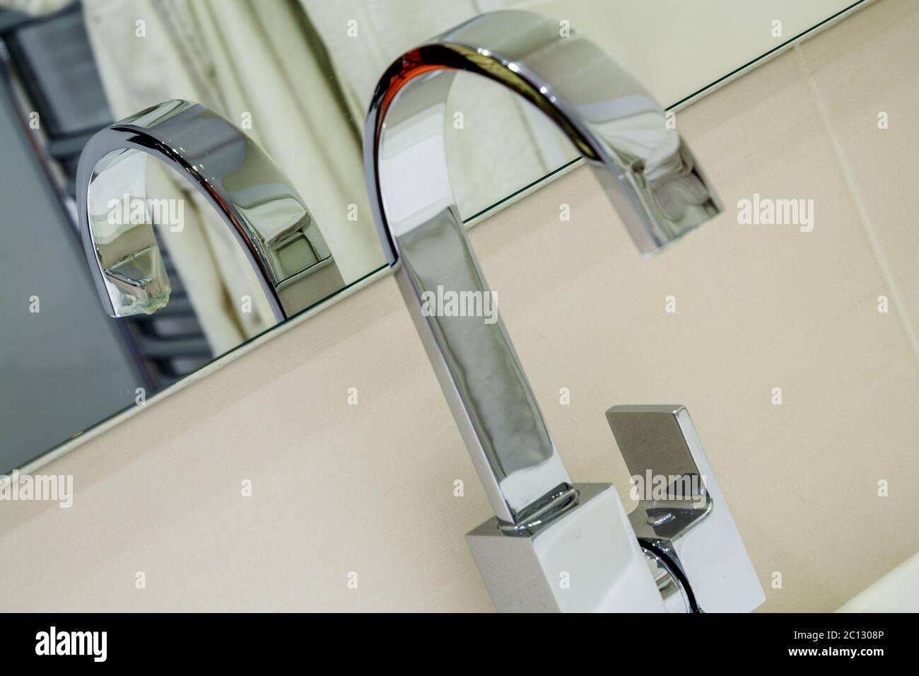 modern stainless steel faucet knob Stock Photo - Alamy