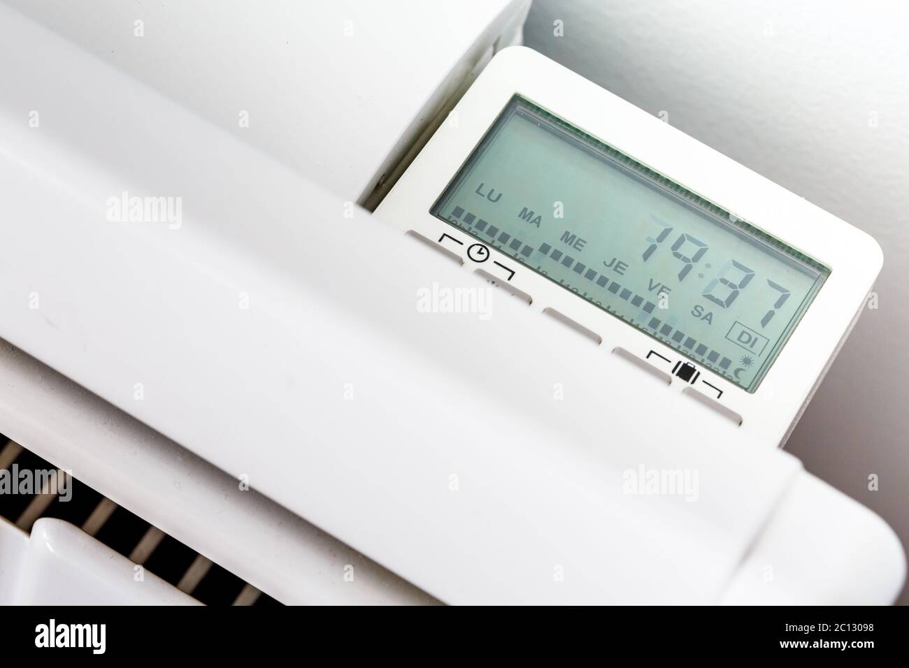 closeup of modern radiator with digital timer Stock Photo - Alamy