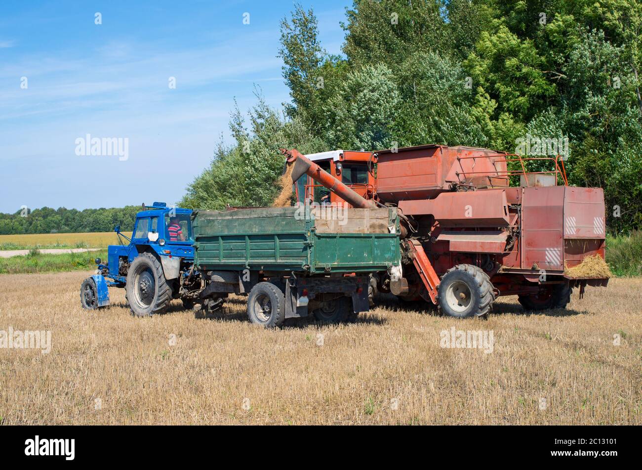 A combine harvest at work Stock Photo - Alamy