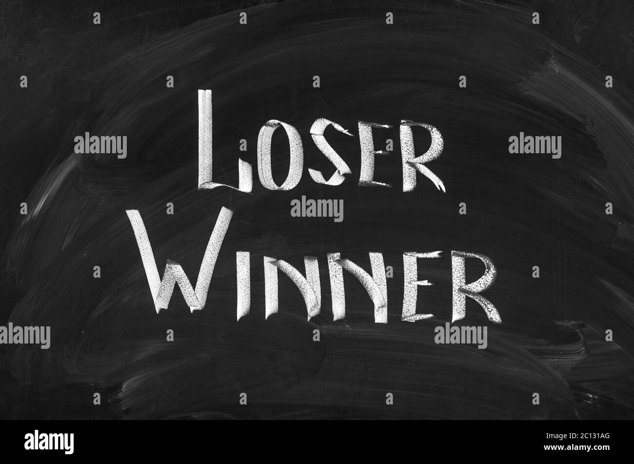 Loser and winner written on the blackboard with chalk Stock Photo - Alamy