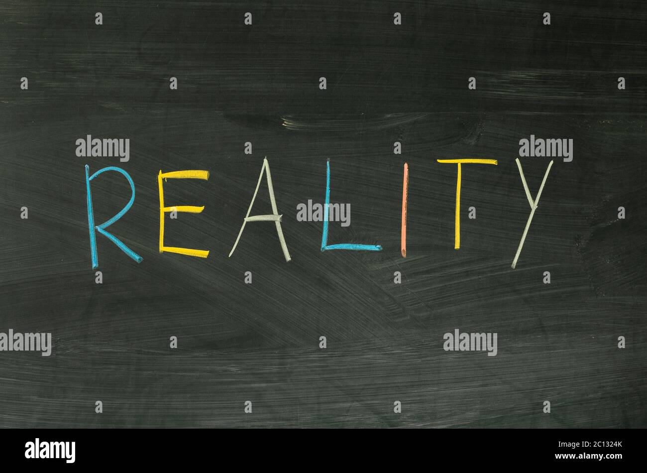 Reality word handwritten on the school blackboard Stock Photo - Alamy