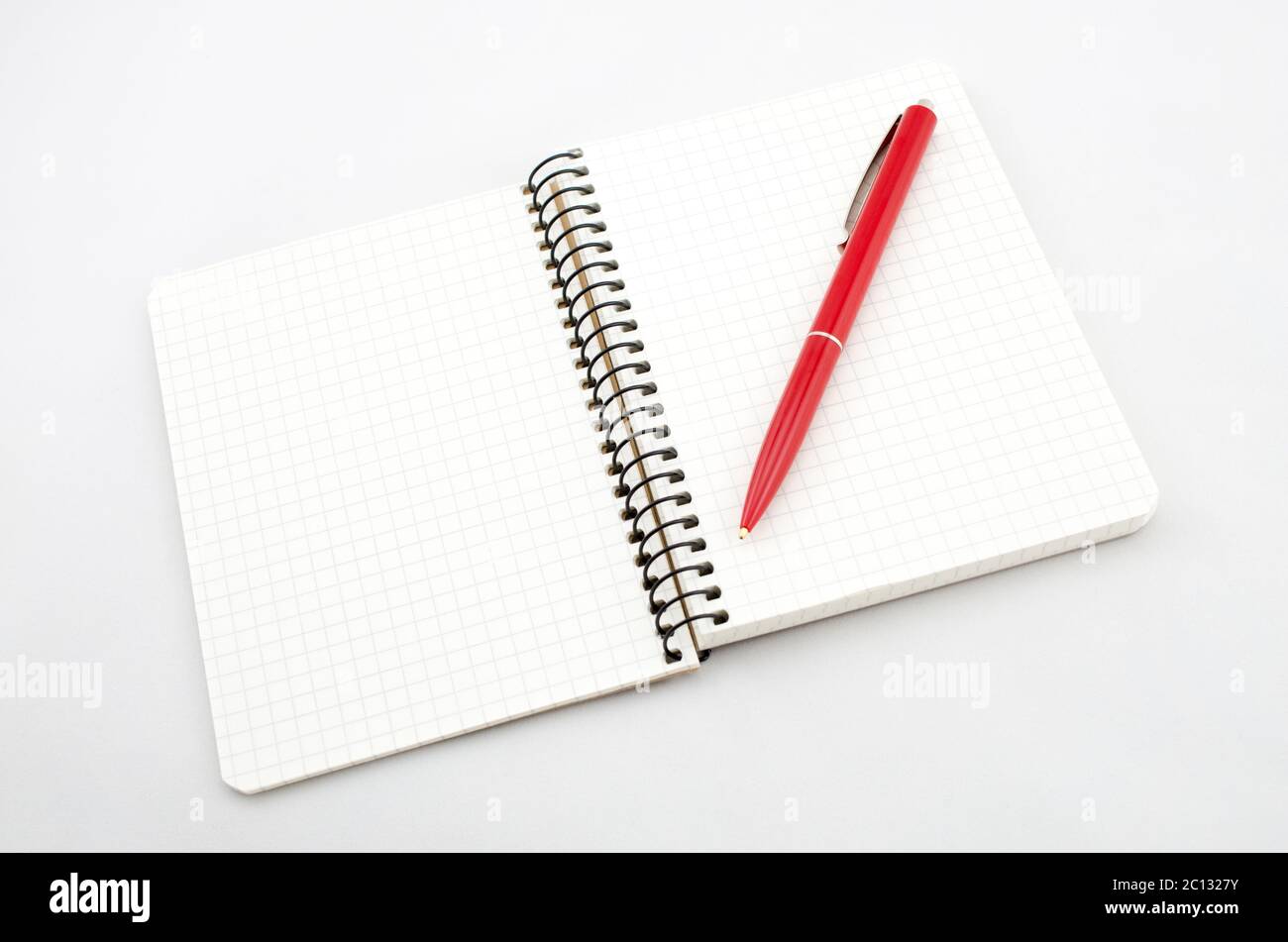 Opened new notebook and red pencil placed on the gray background Stock ...