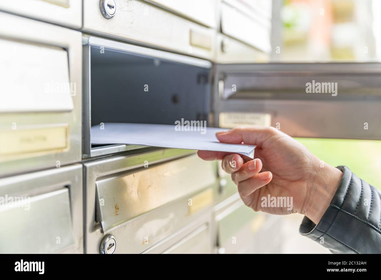letter in the mailbox of an apartment building Stock Photo - Alamy