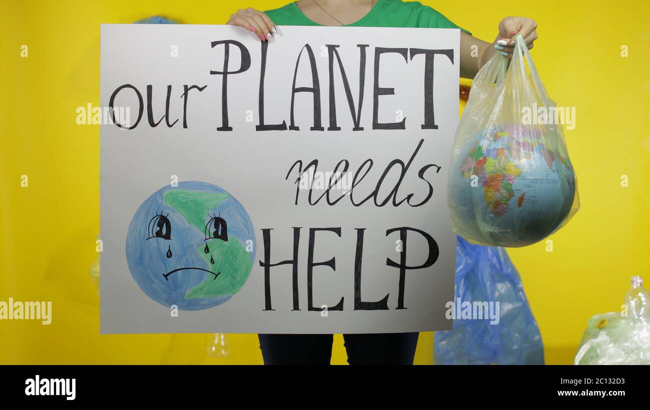 Unrecognizable woman girl volunteer in t-shirt with recycle logo with ...