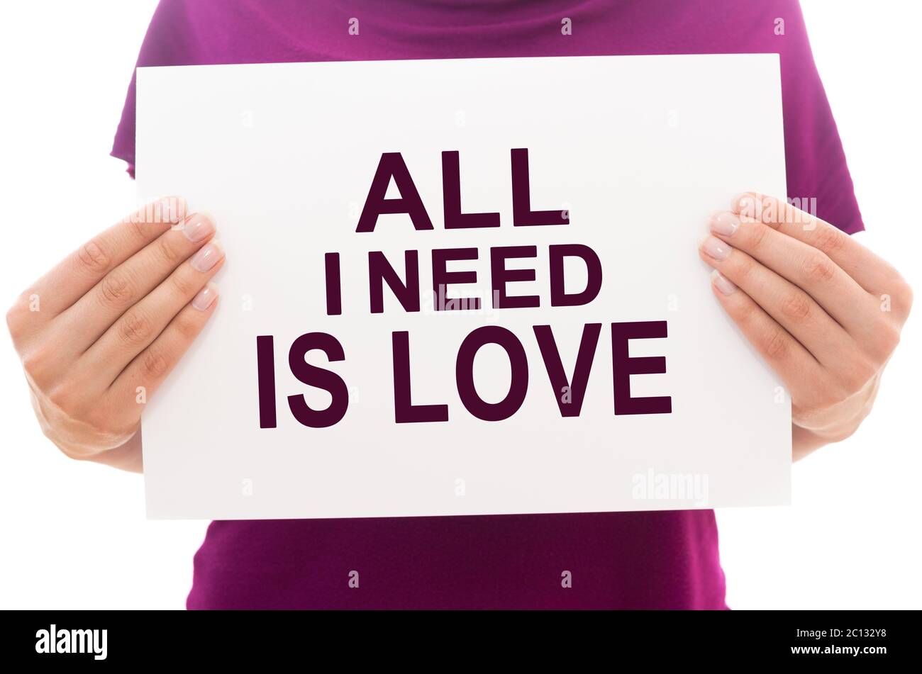 Girl holding white paper sheet with text All I need is love Stock Photo ...