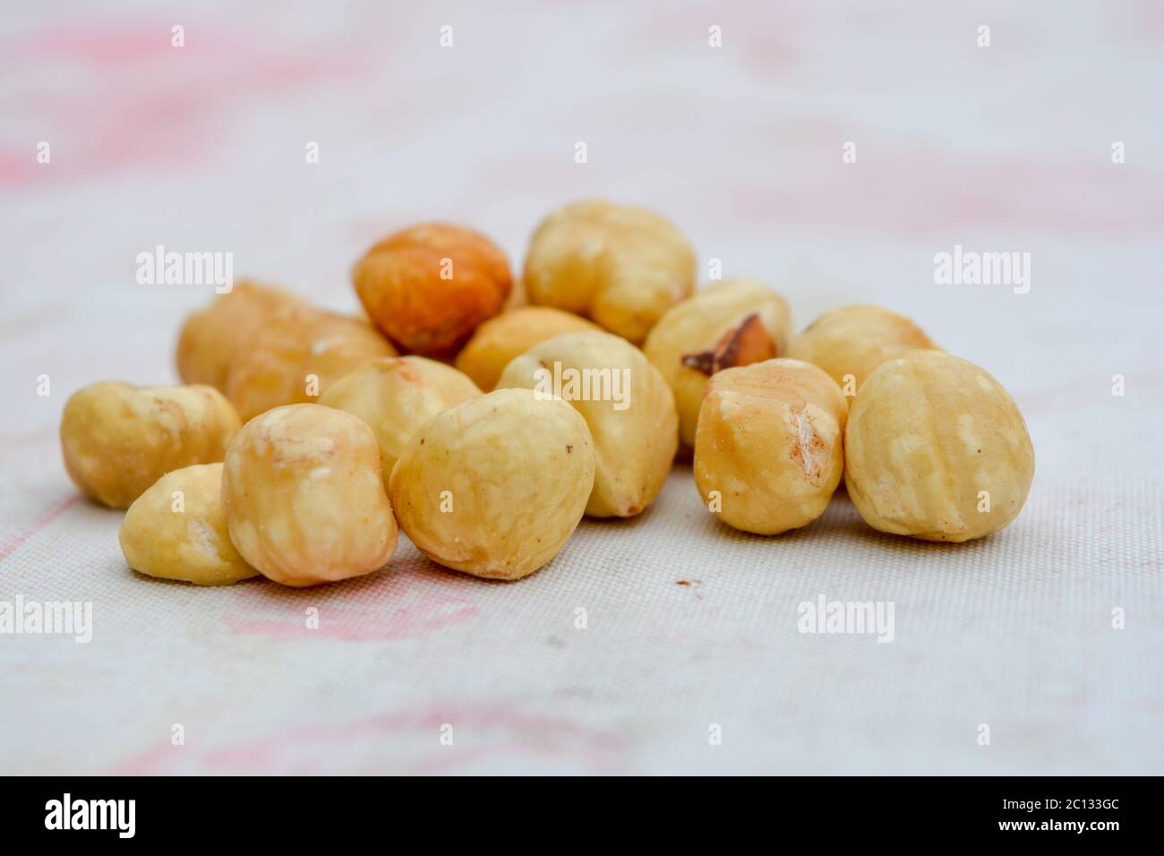 Natural looking toasted hazelnuts. Delicious bunch of roasted nuts on a ...