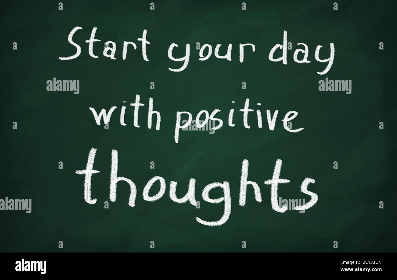 On the blackboard write Start your day with positive thoughts Stock ...