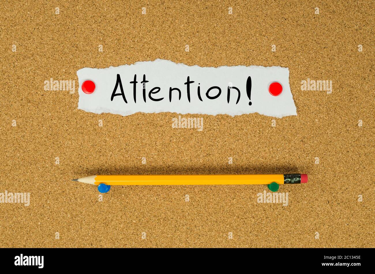 Attention text note message pin on bulletin board Stock Photo - Alamy