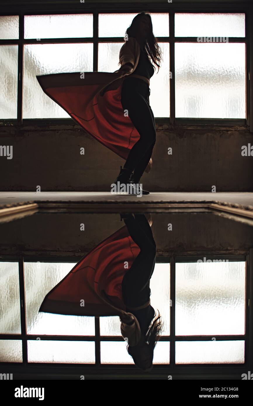 reflection silhouette of woman dancer in front of window wall Stock ...