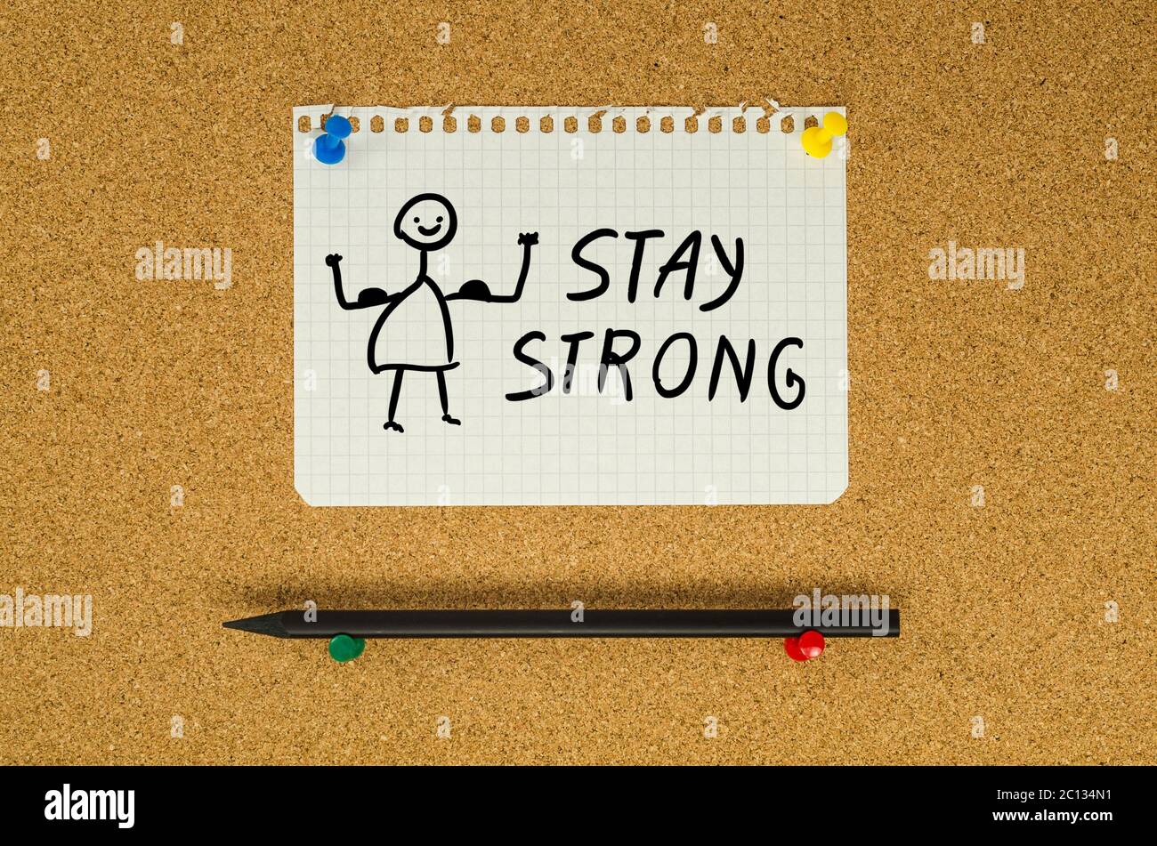 Stay strong text note message pin on bulletin board Stock Photo - Alamy