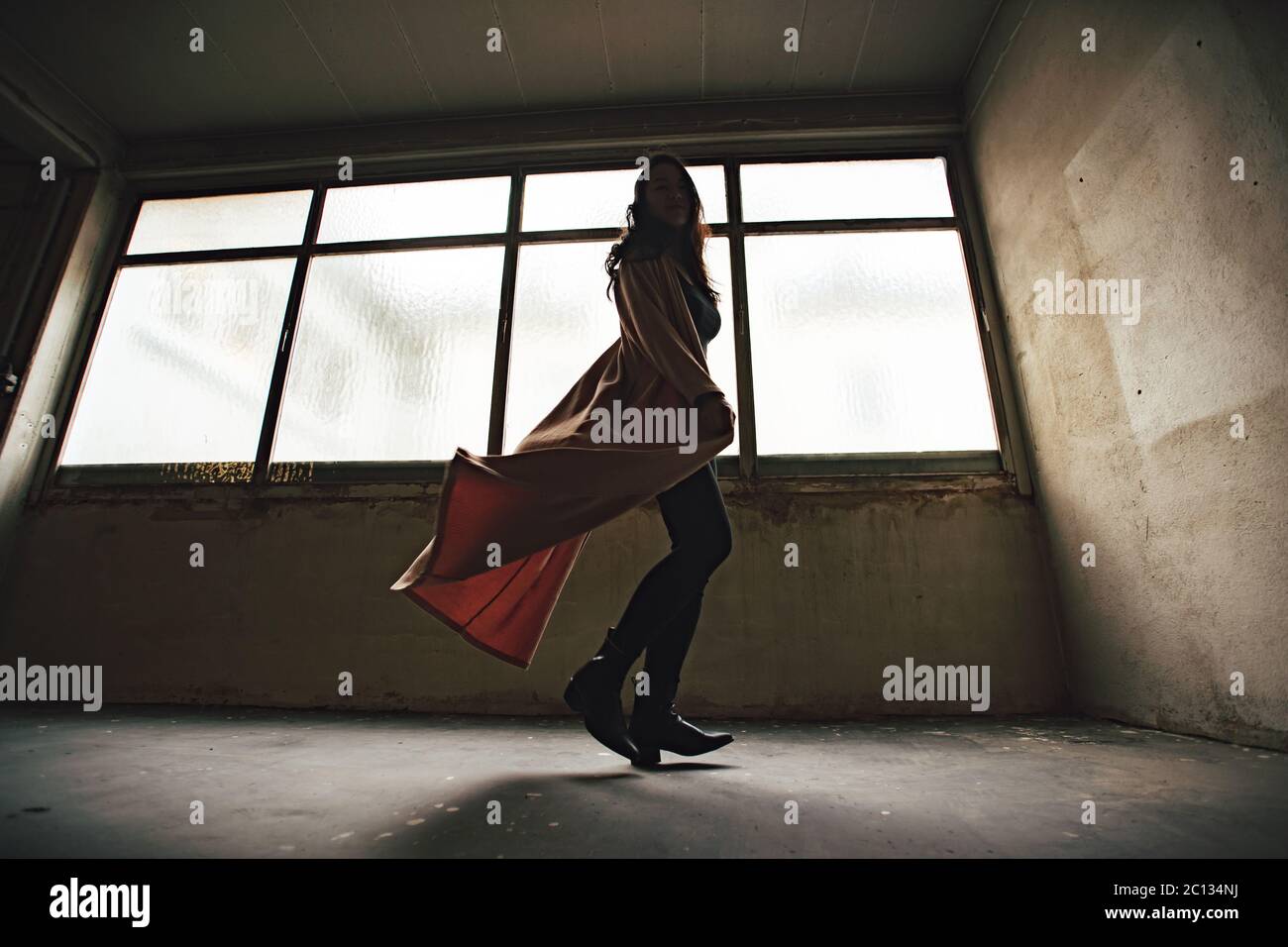 reflection silhouette of woman dancer in front of window wall Stock ...