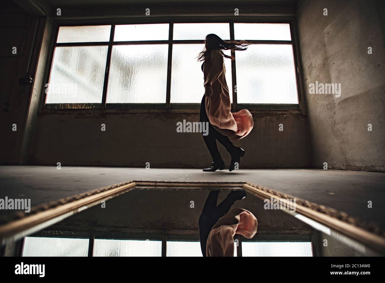 reflection silhouette of woman dancer in front of window wall Stock ...