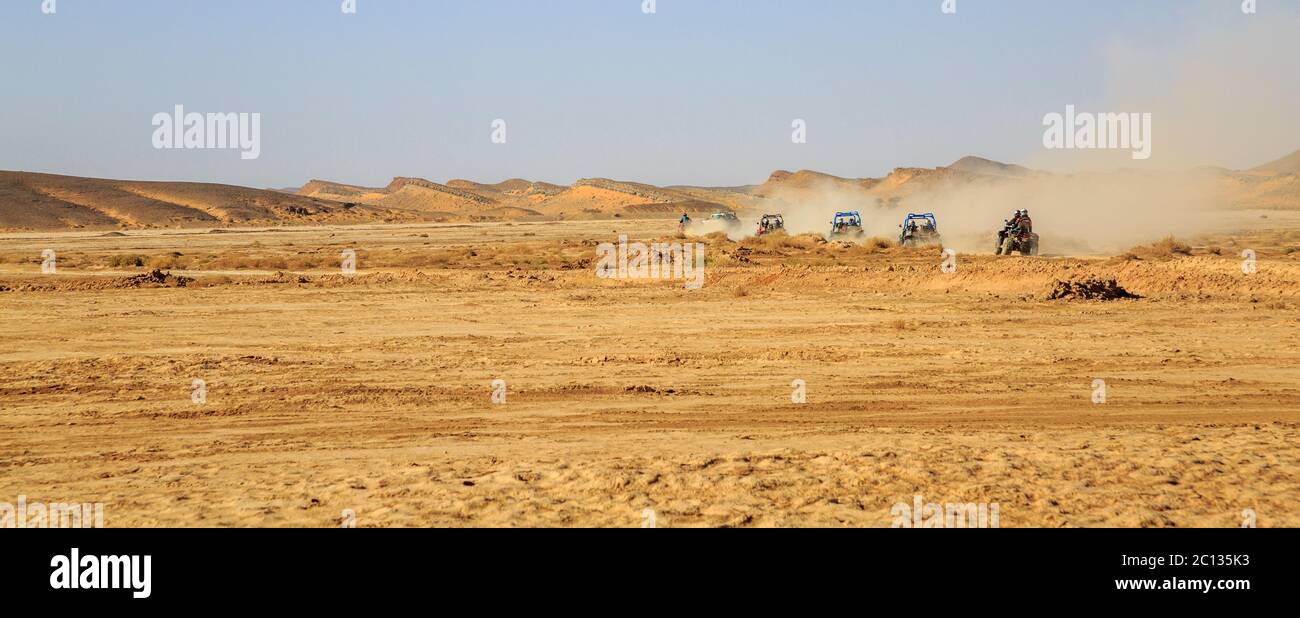 off road car with it's pilot in Morocco Stock Photo - Alamy