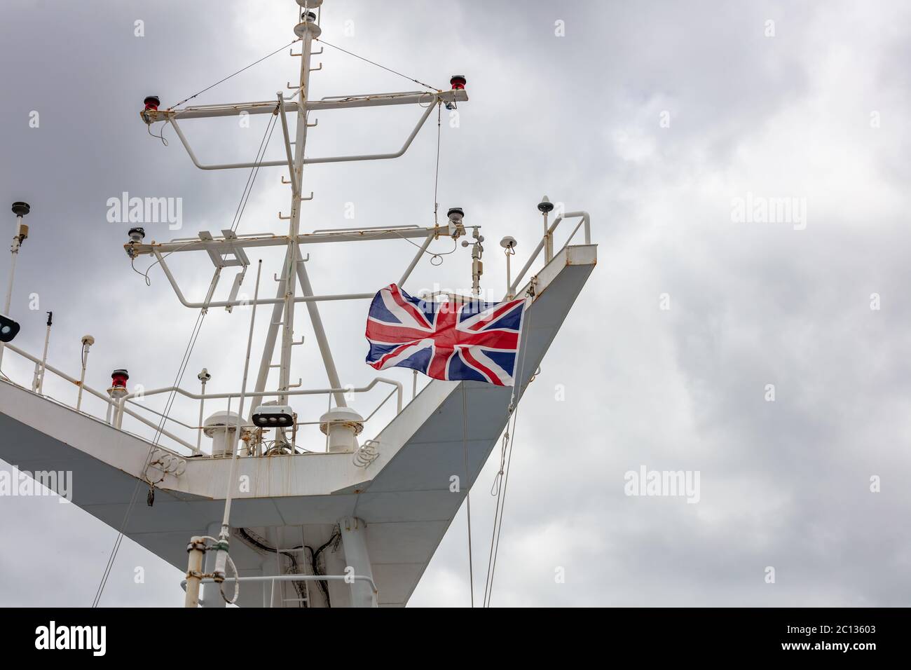 Great Britain's flag waving in the wind on the ship's mast Stock Photo ...