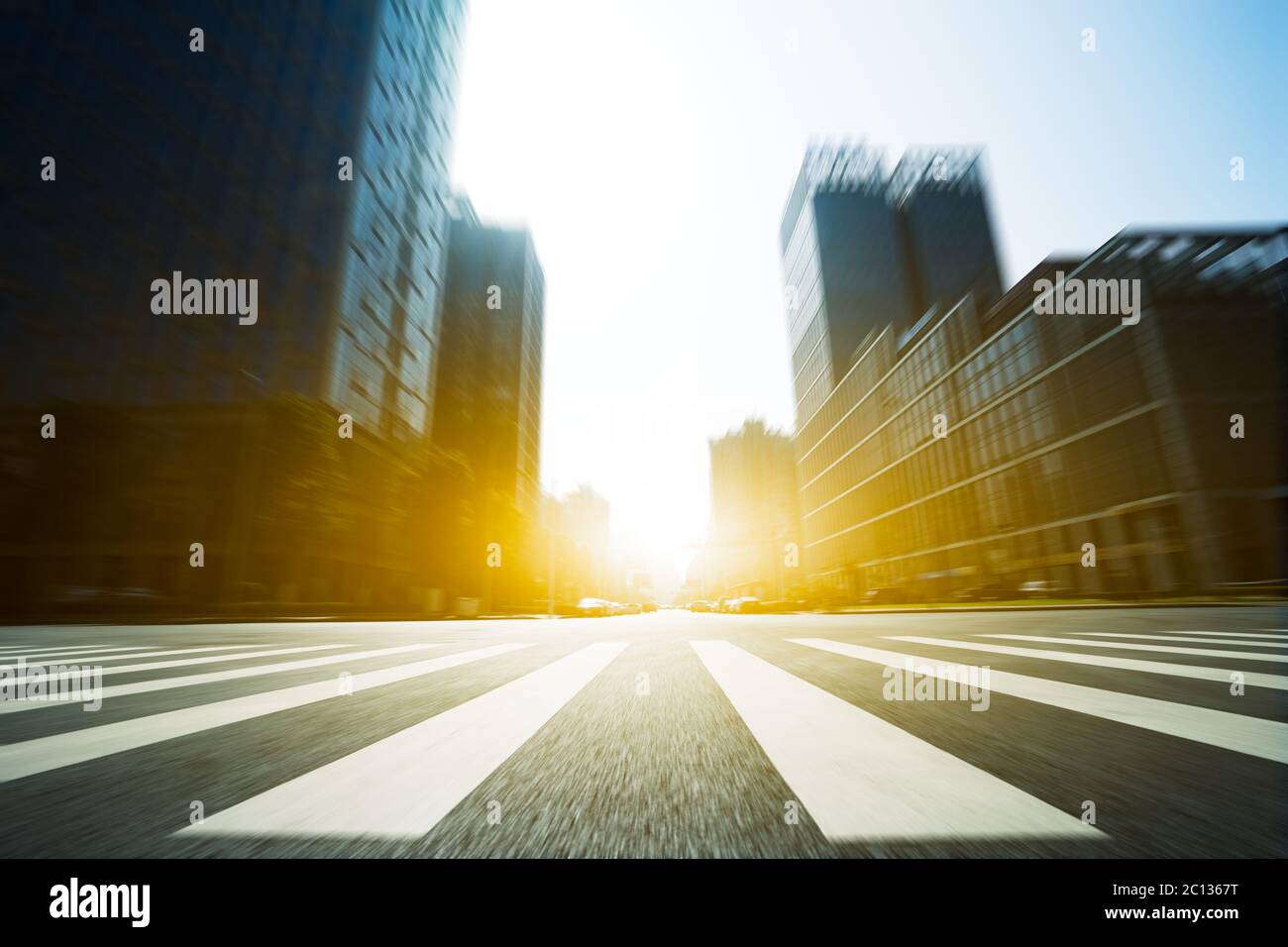 blur road and modern office buildings in hangzhou with sunbeam Stock ...