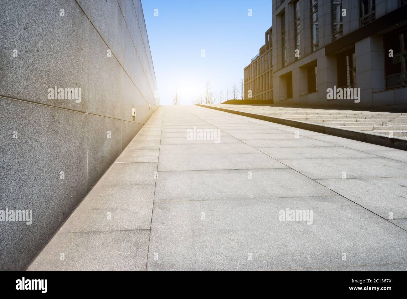 empty footpath between modern building with sunbeam Stock Photo - Alamy