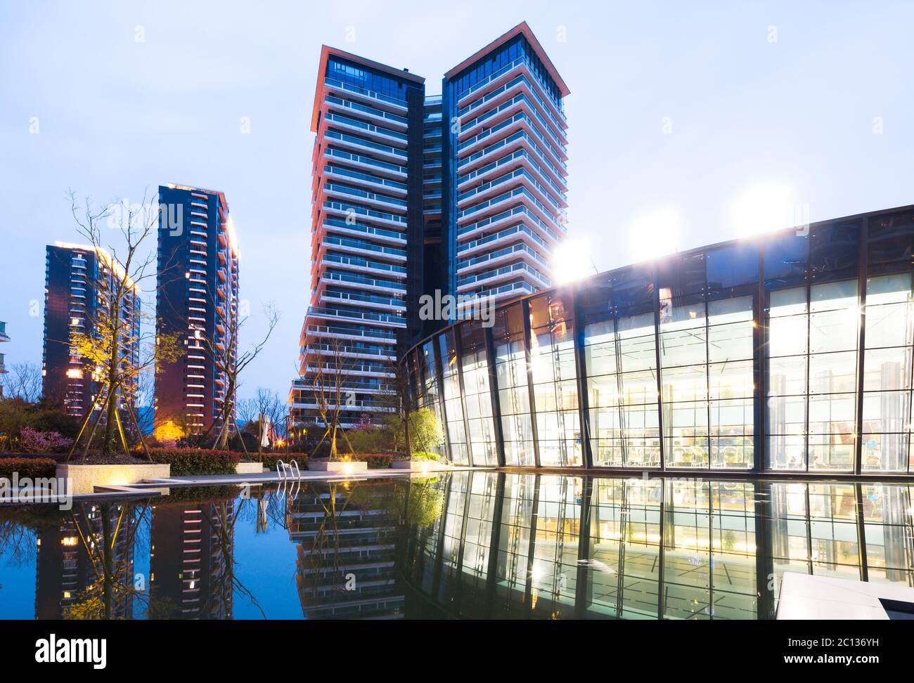 modern buildings near water in hangzhou at twilight Stock Photo - Alamy