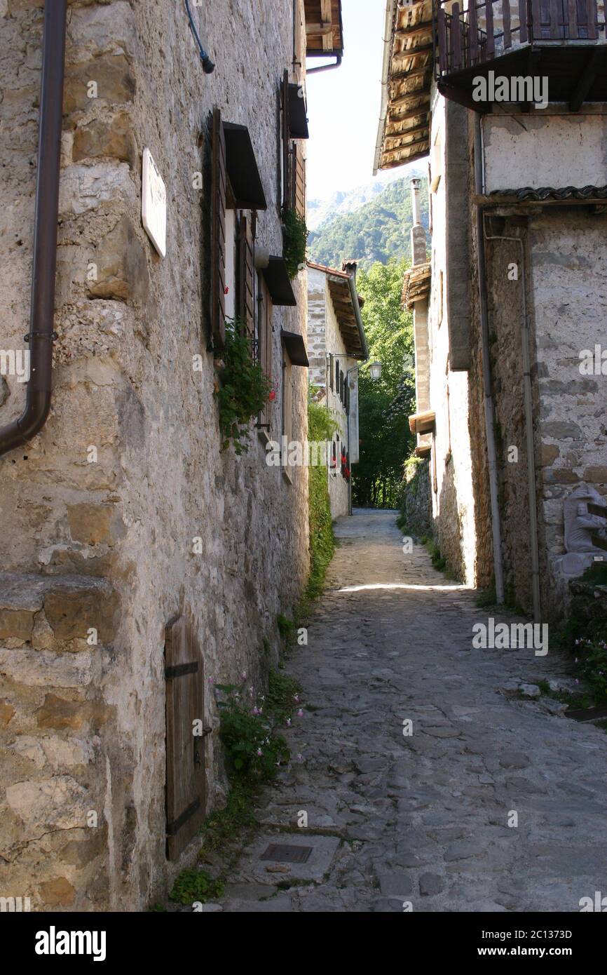 Narrow alley between original houses in the picturesque village of ...