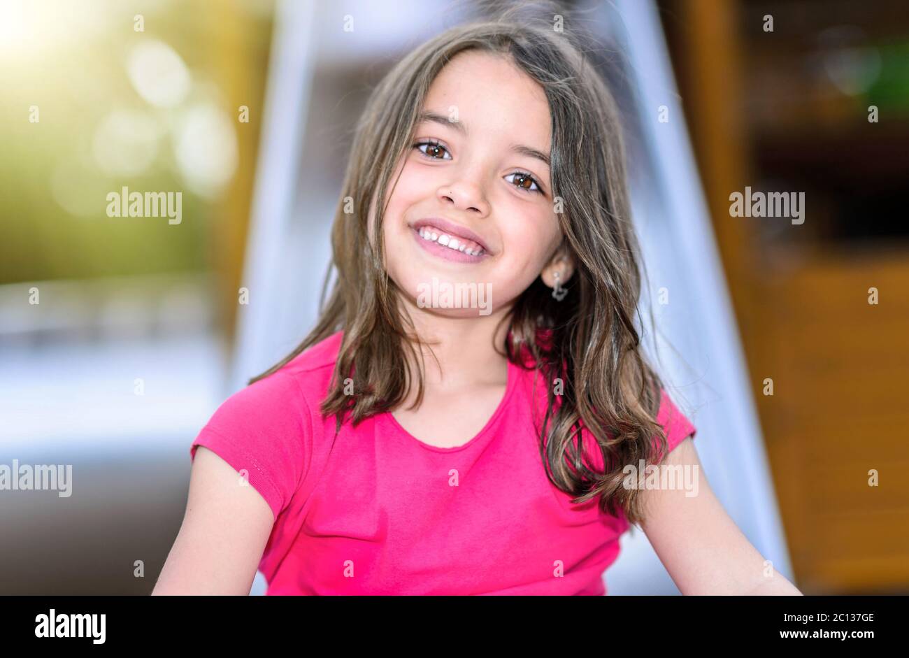 Happy cute little girl in playground Stock Photo - Alamy