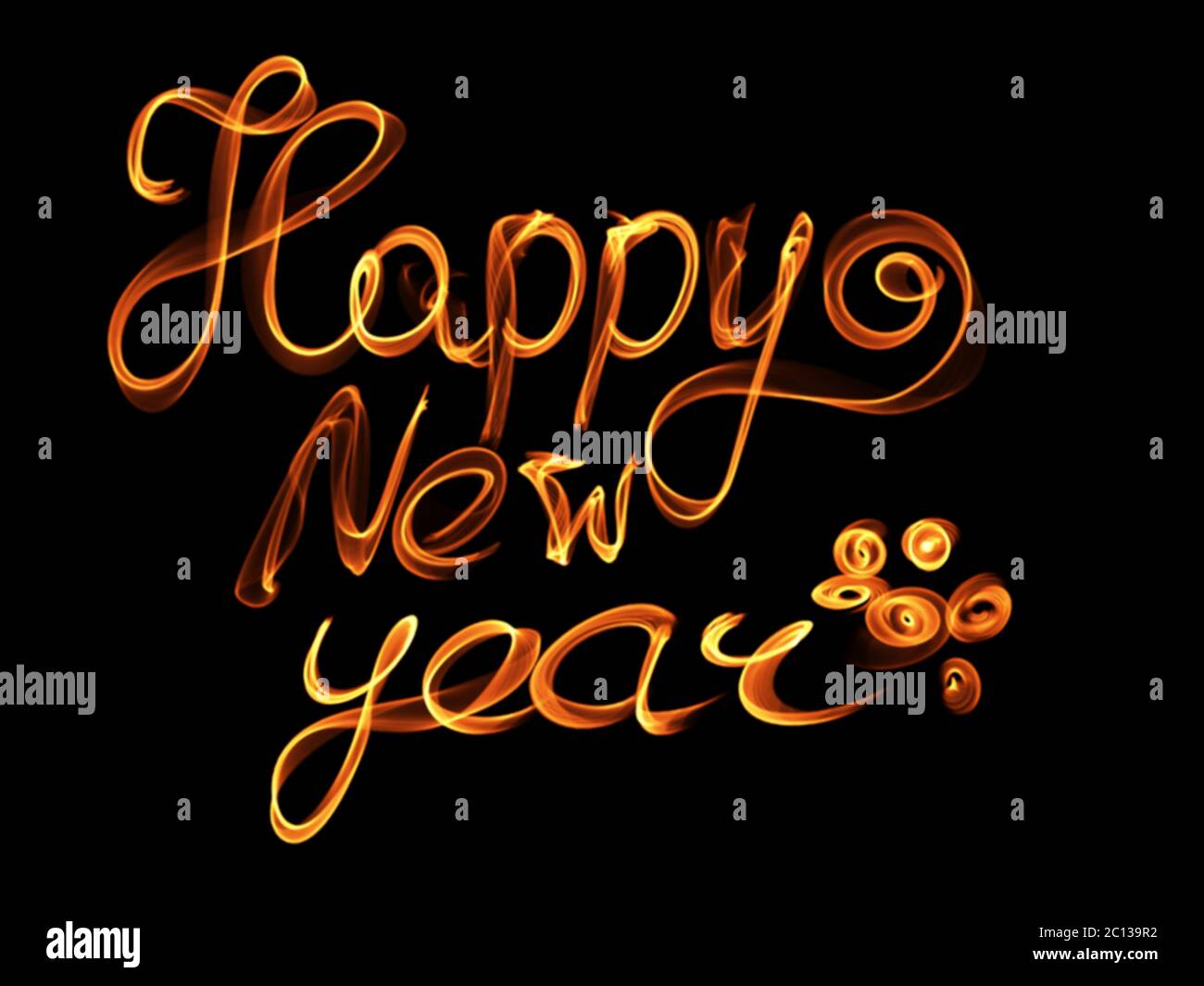 Happy new year isolated words lettering written with fire flame or ...