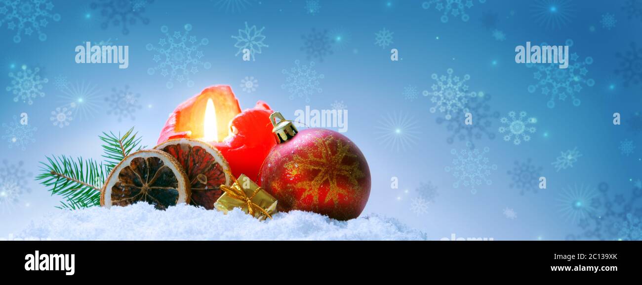 Blue Christmas background with red advent candle Stock Photo - Alamy