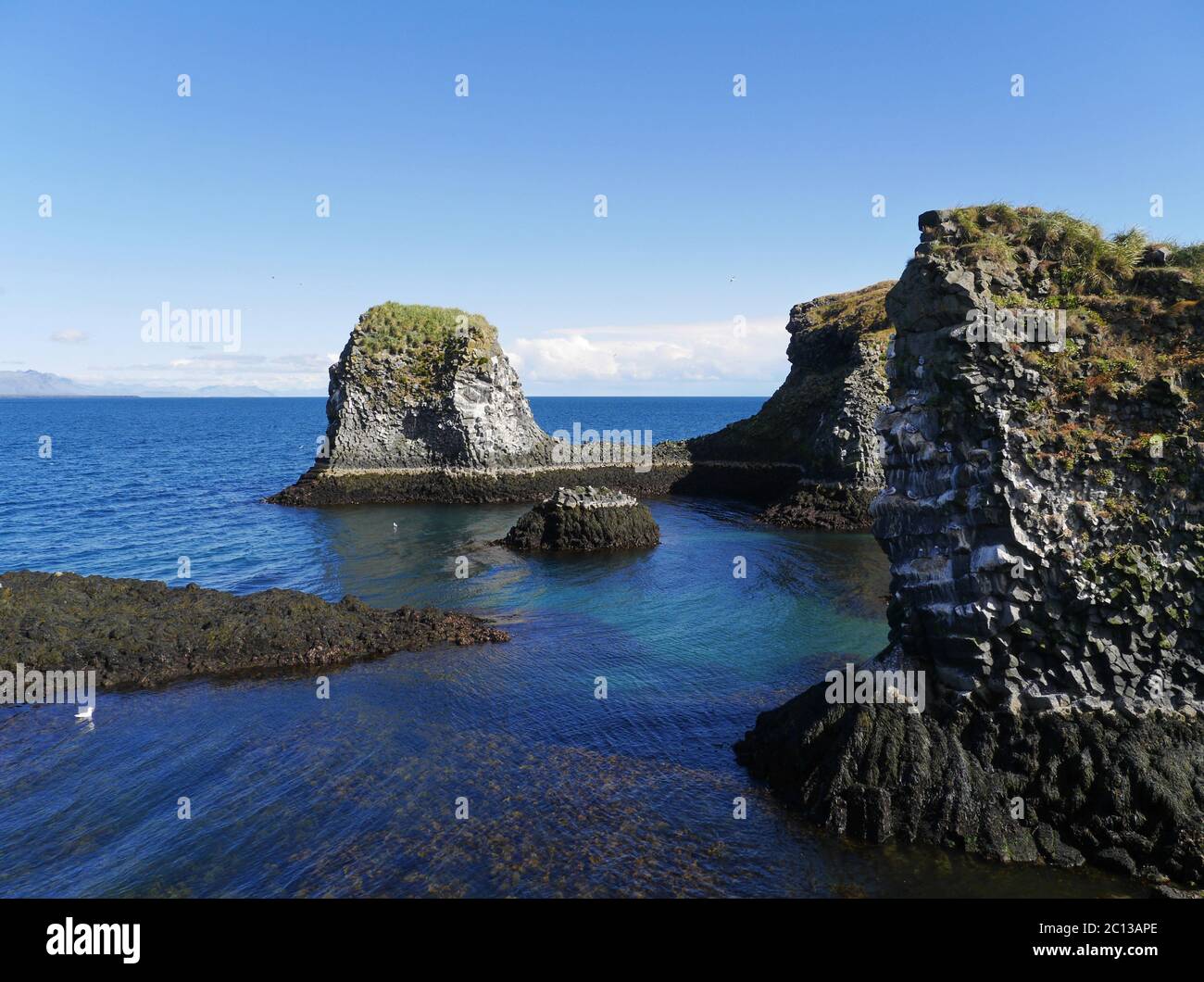 Basalt rocks at the volcanic cliff coast of Arnarstapi in Iceland Stock ...