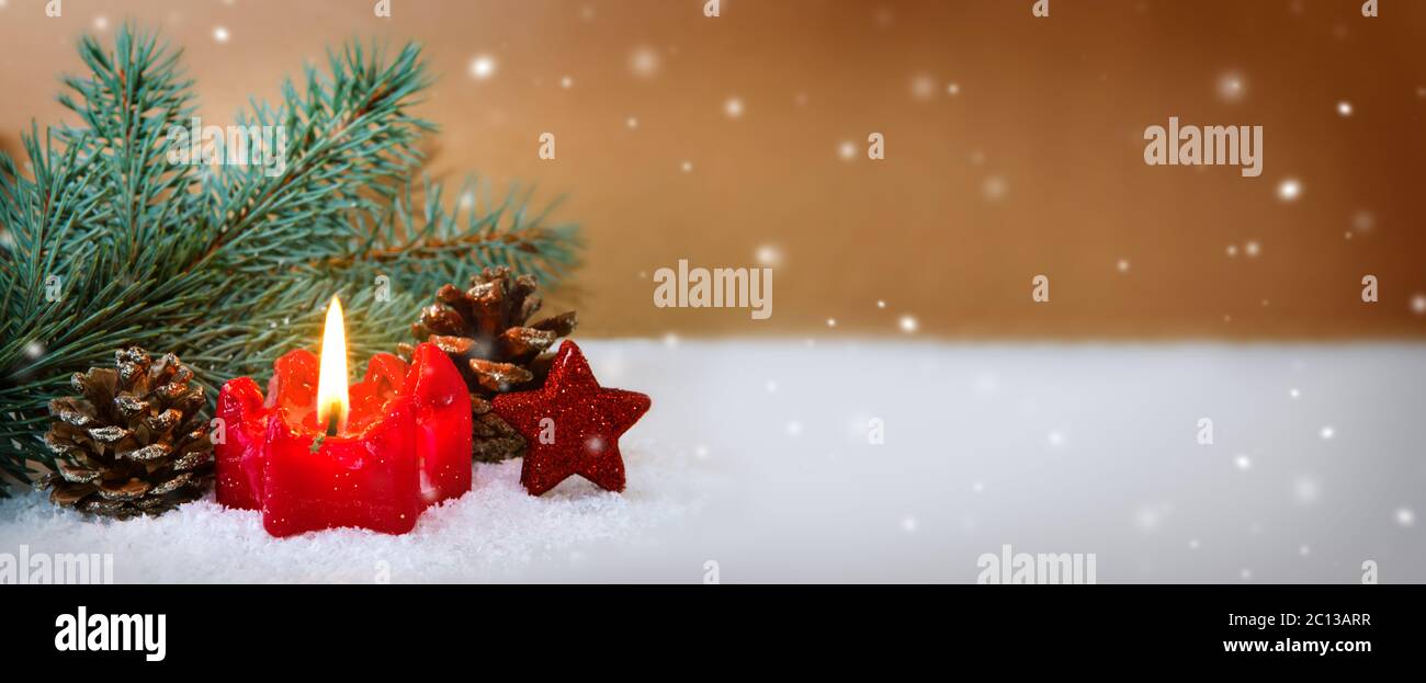 Advent candle and snow Stock Photo - Alamy