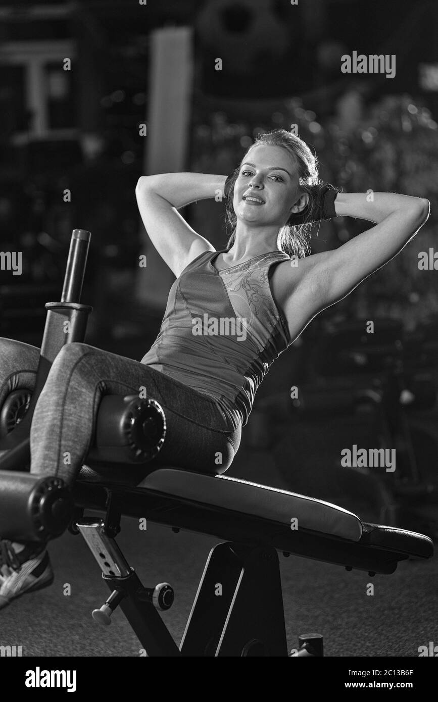 Woman doing strength exercises for abs muscles Stock Photo - Alamy