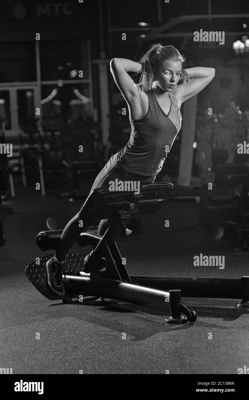Woman doing strength exercises for abs muscles Stock Photo - Alamy