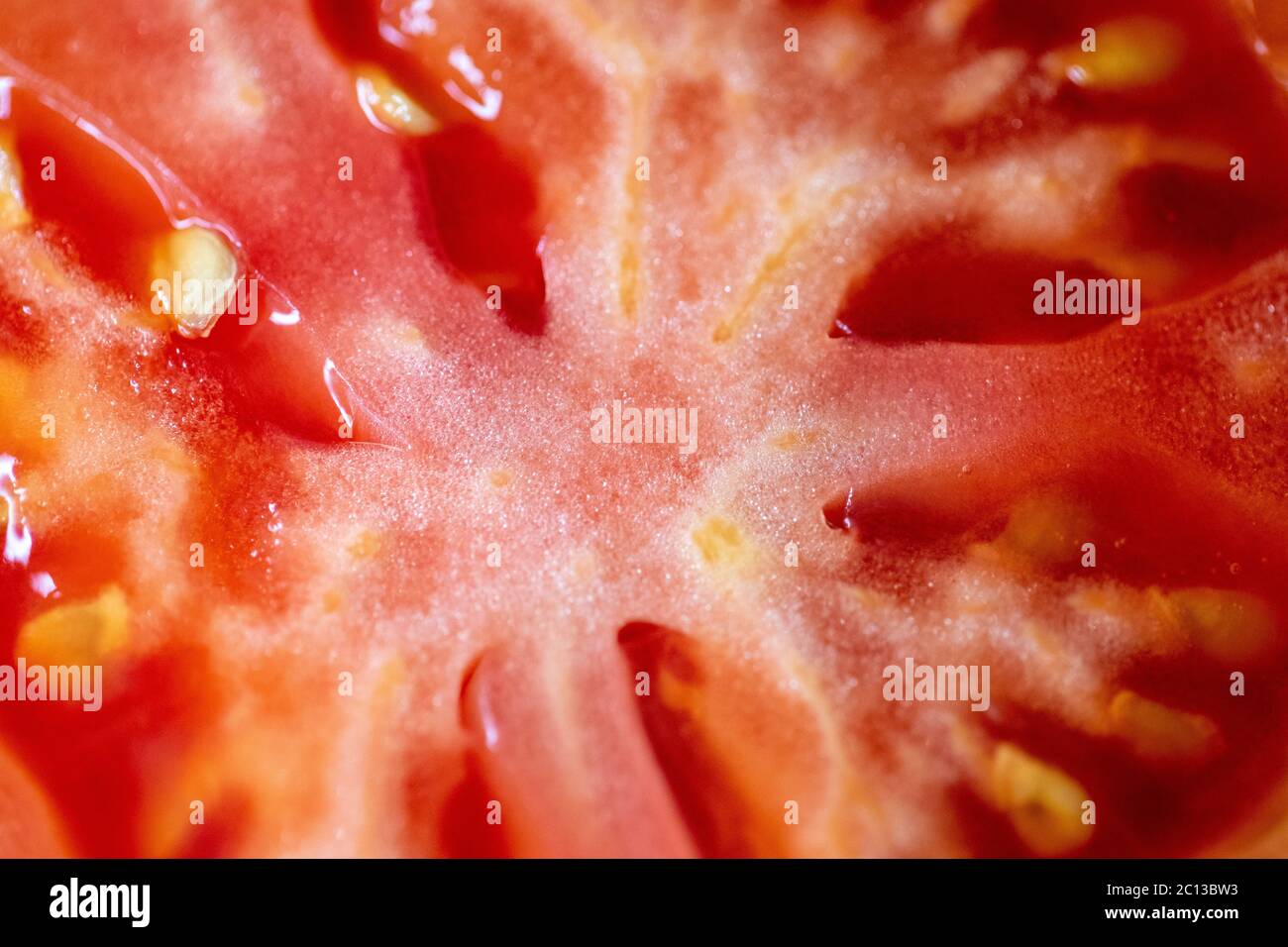 Red ripe tomato sliced Stock Photo - Alamy