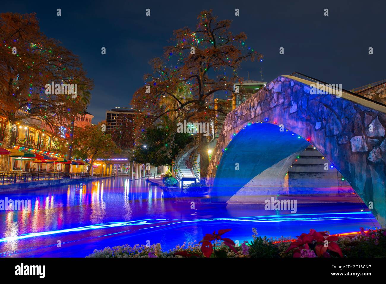 San Antonio River Walk and stone bridge over San Antonio River near ...