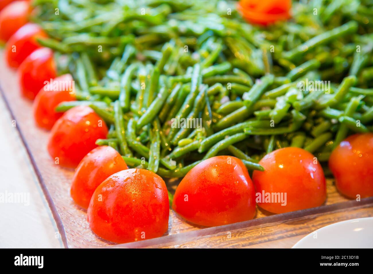 Cooked green beans with tomato during typical french buffet Stock Photo ...