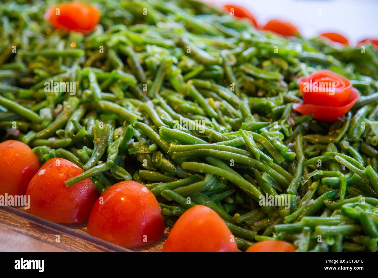 Cooked green beans with tomato during typical french buffet Stock Photo ...