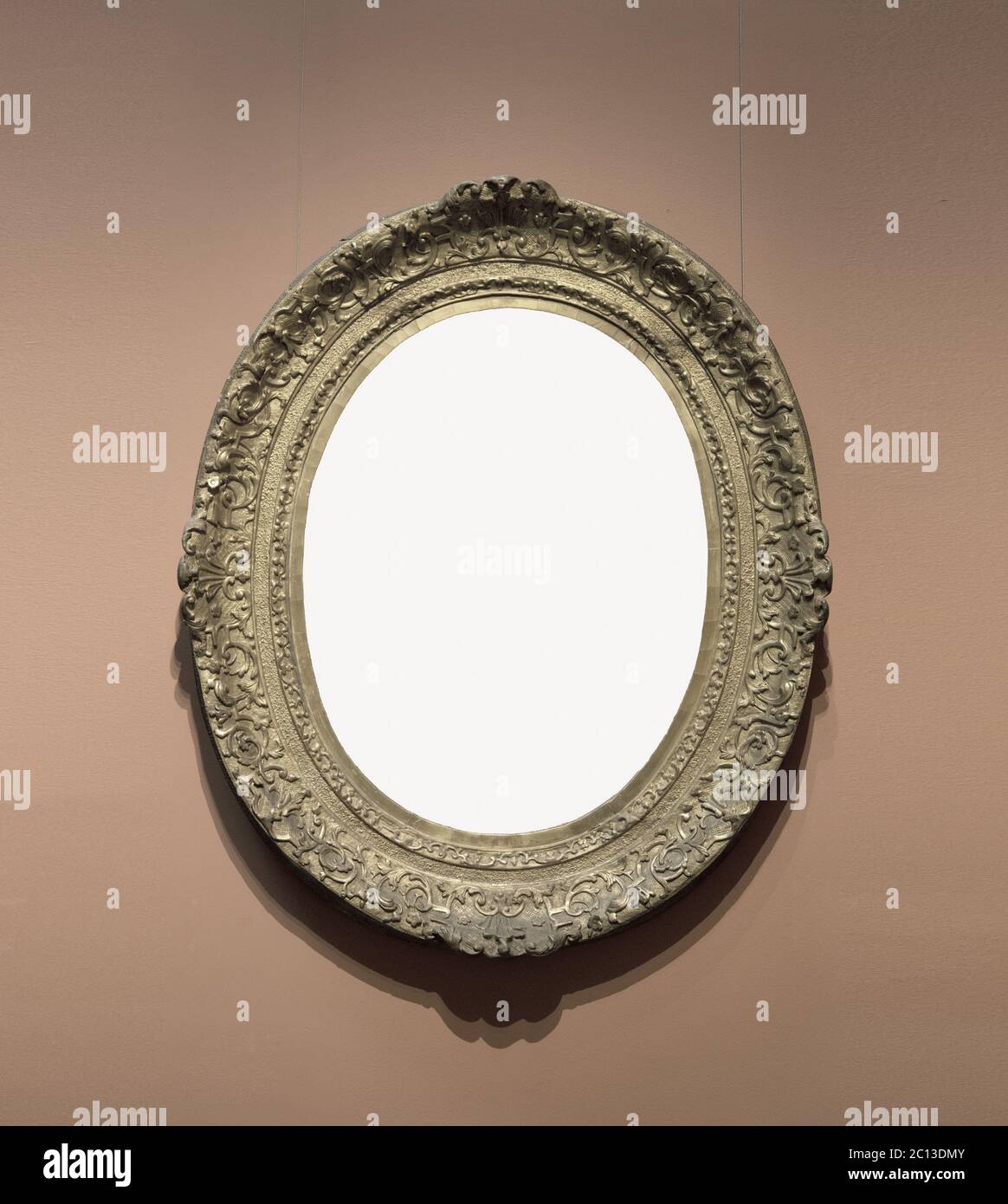 Old-fashioned oval frame on wall Stock Photo - Alamy