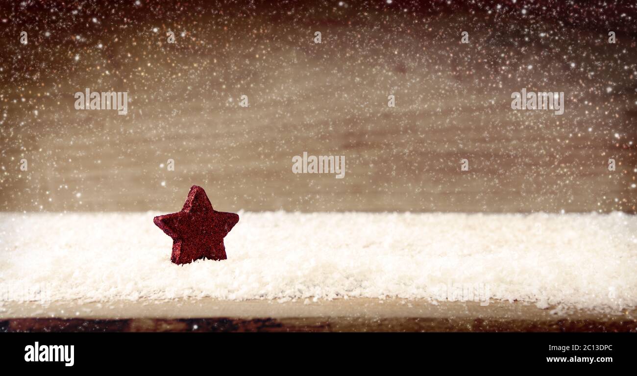 Christmas wooden background with star and snowfall Stock Photo - Alamy